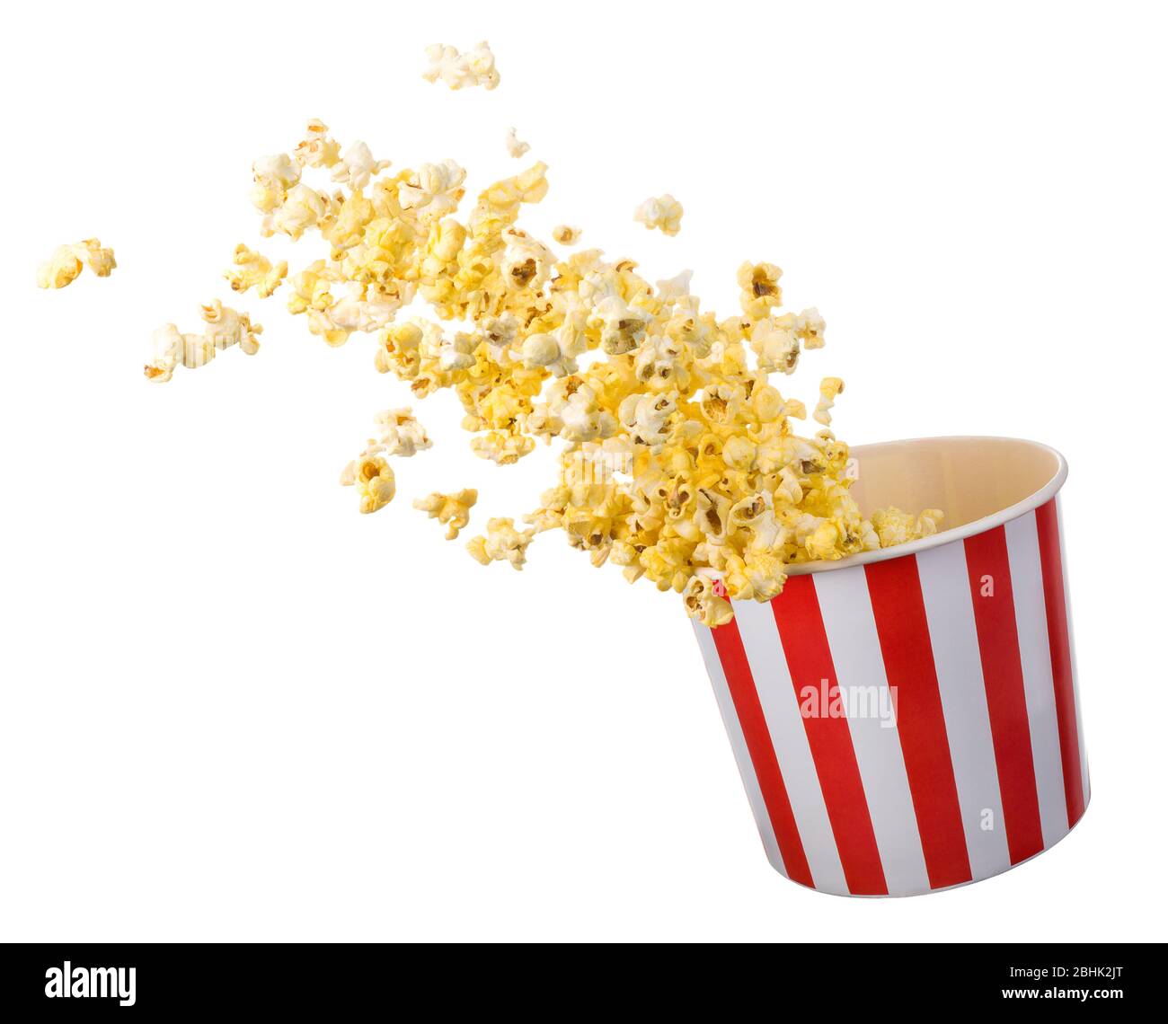 Flying popcorn from paper striped bucket isolated on black background ...