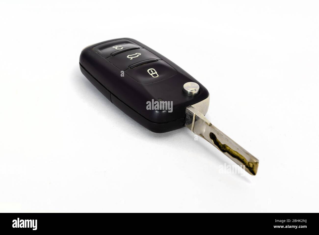 Isolated white background of black modern car key. Close up car key fob ...