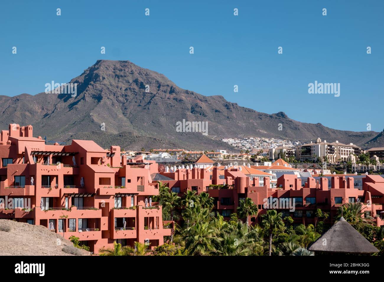 View of Roque del Conde, flat top mountain, over hotels and apartments ...