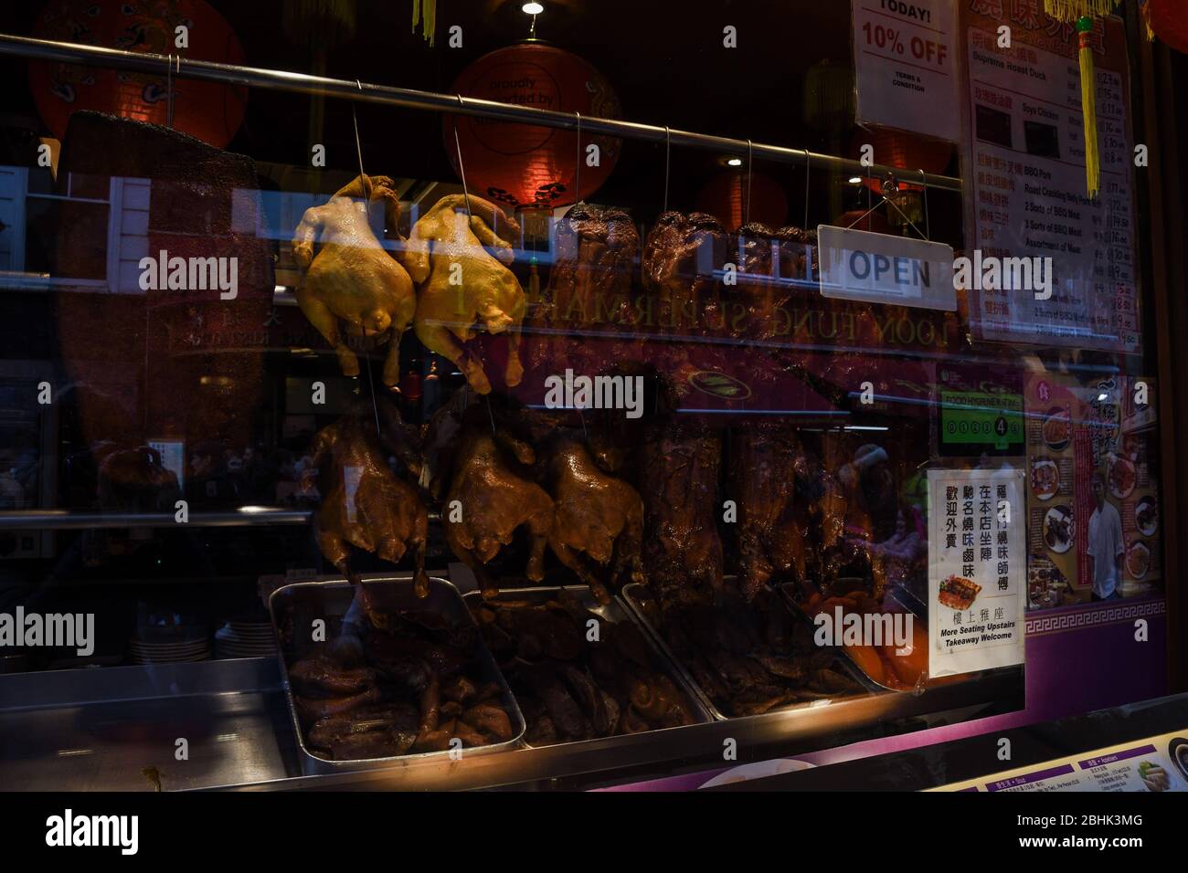 Roasted ducks hanging on rack showcase in restaurant's kitchen Stock ...