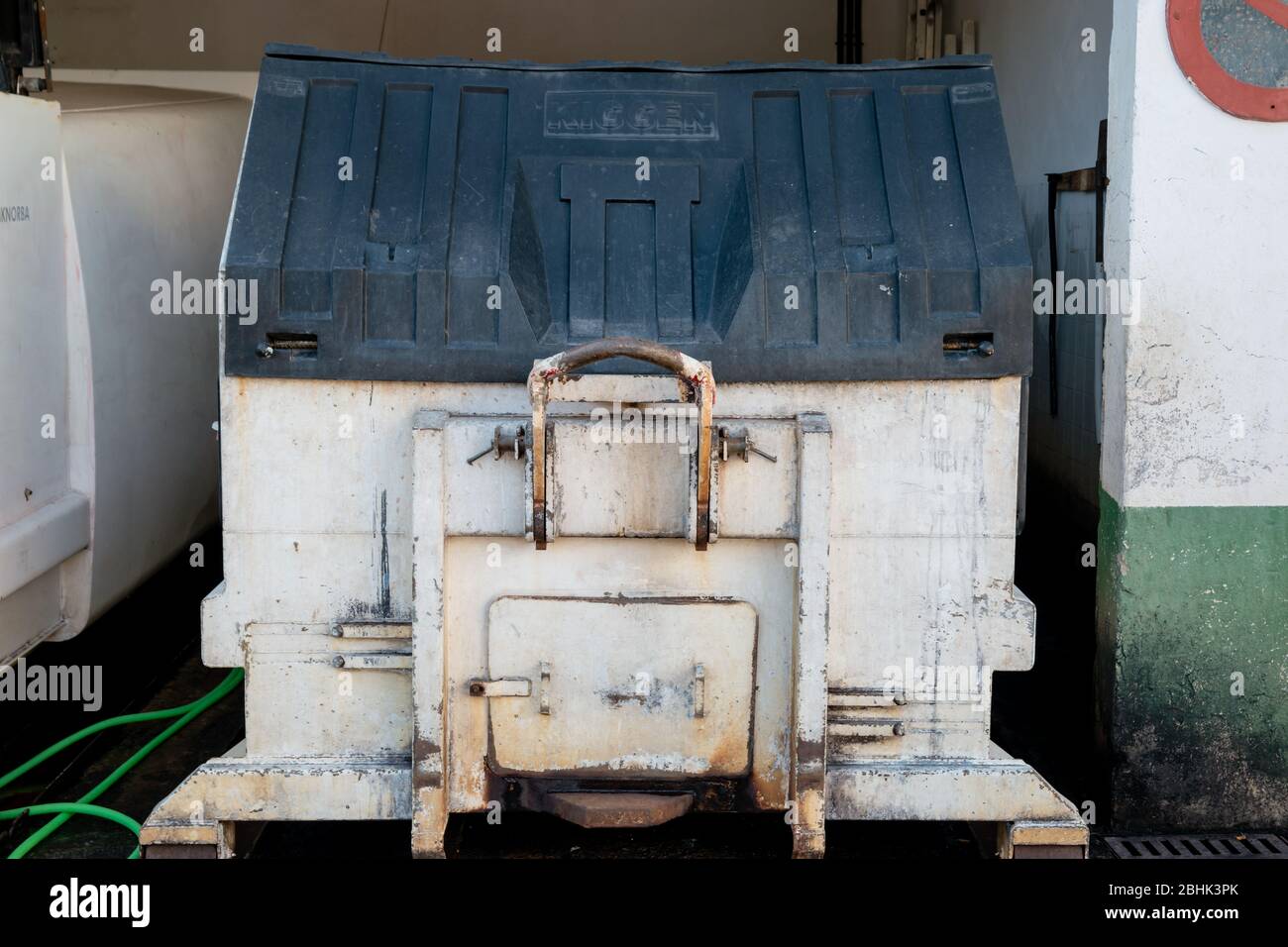 A large communal waste bin - Kiggen portable compactor Stock Photo - Alamy