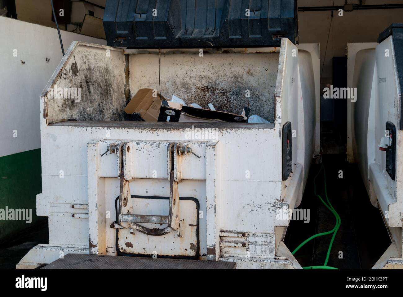 A large open communal waste bin - Kiggen portable compactor Stock Photo ...