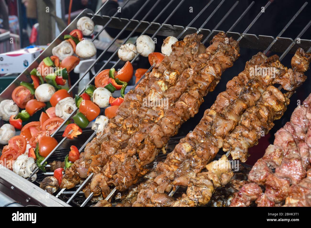 Barbecue skewers meat kebabs with vegetables on flaming grill Stock ...