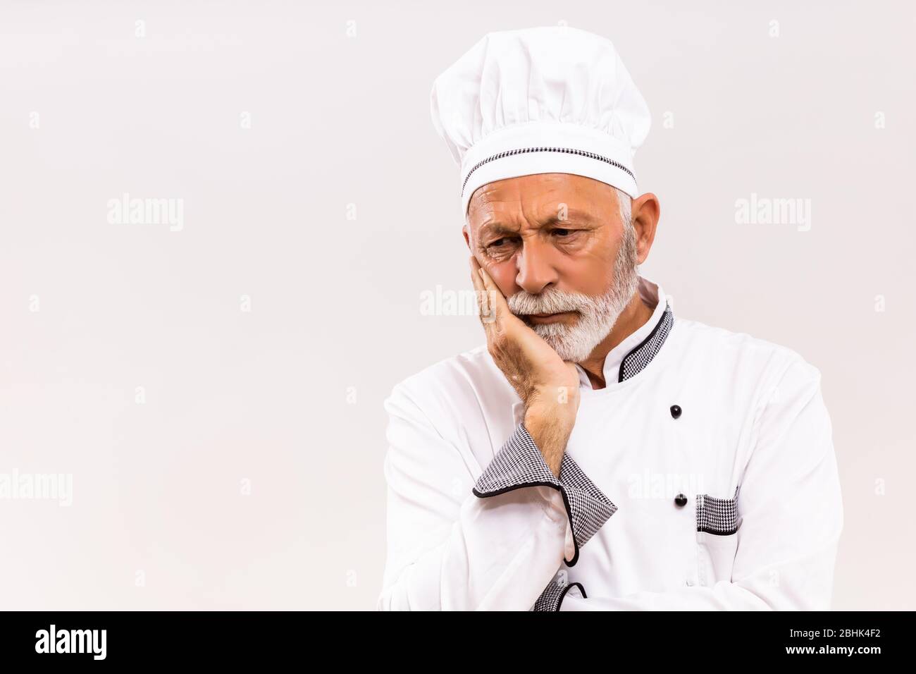 Image of sad chef on gray background Stock Photo - Alamy