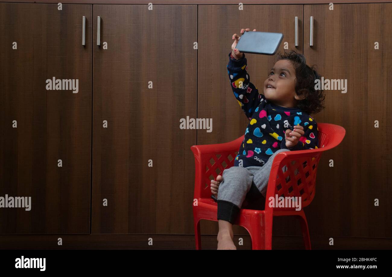 child looking in mobile screen Stock Photo - Alamy