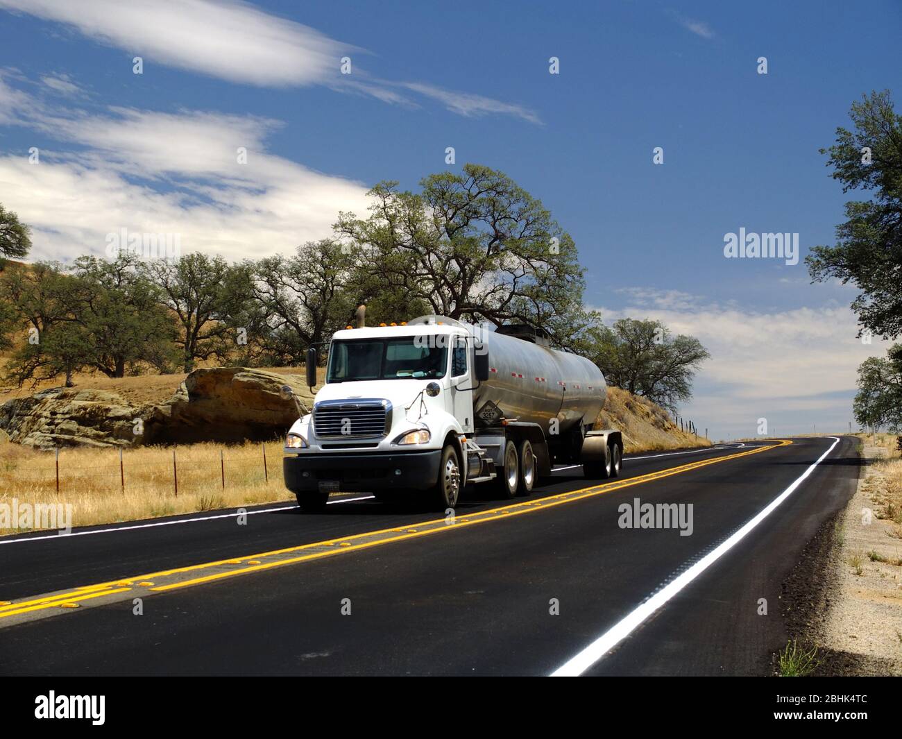 Commercial tanker truck driving along highway 166 in Central California ...