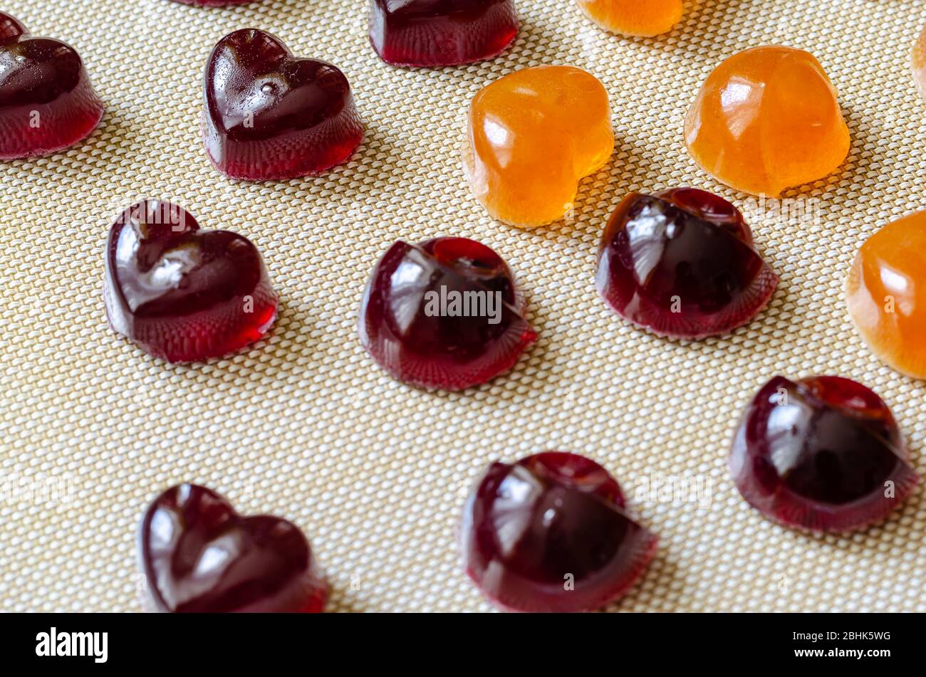 Homemade gelatin sweets. Jelly candies with cherry and orange juice ...