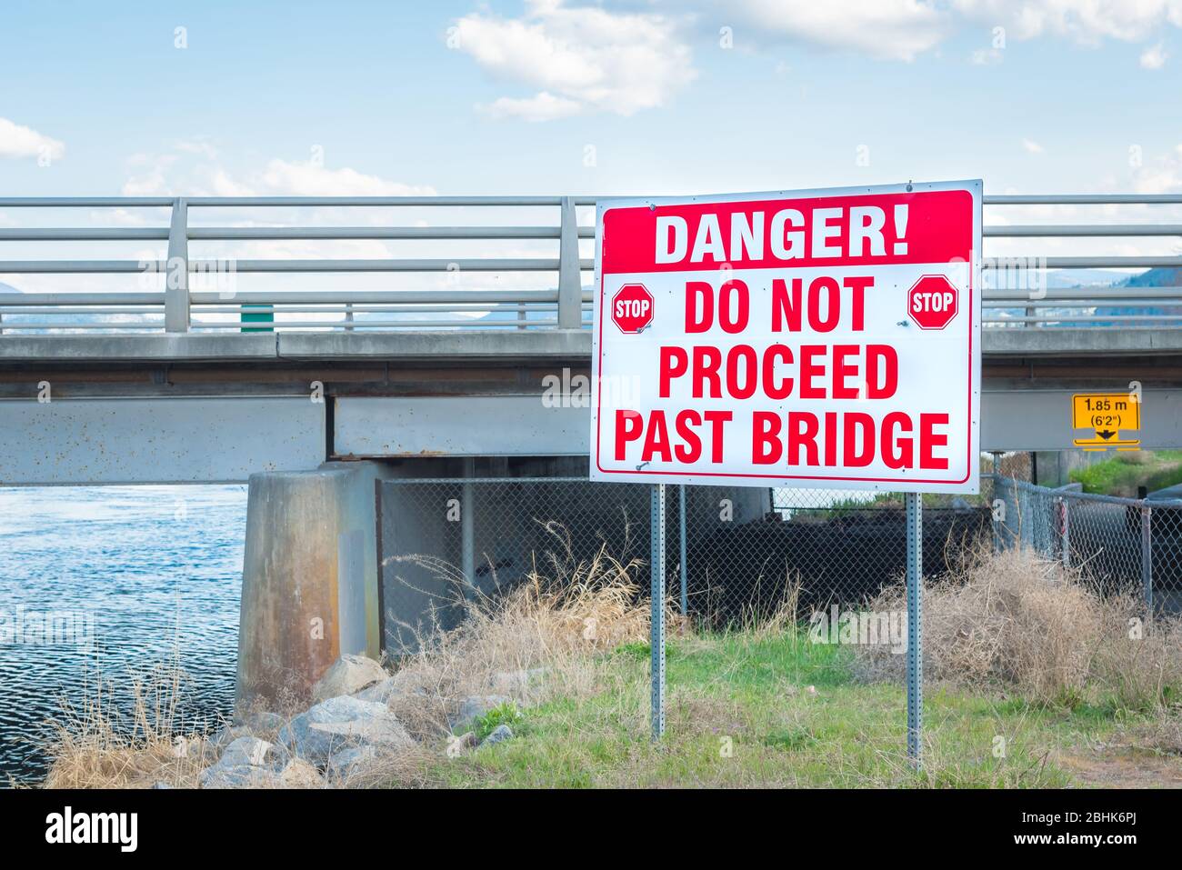 Large danger sign where river channel enters lake under bridge Stock ...