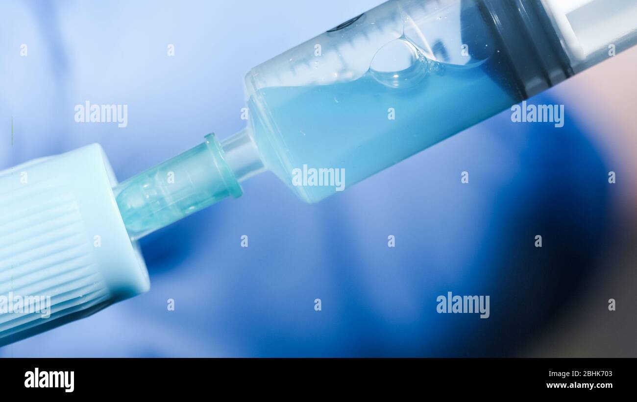 Doctor Drawing Vaccine Into Syringe in laboratory Stock Photo - Alamy