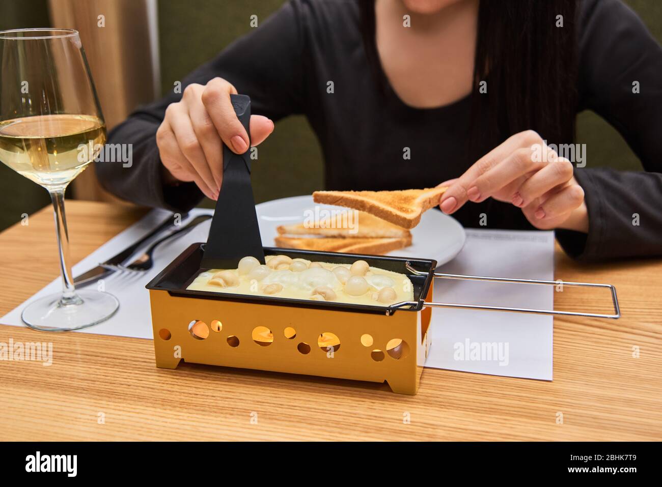 swiss food. cheese raclette with mushrooms on coupelles - special small ...
