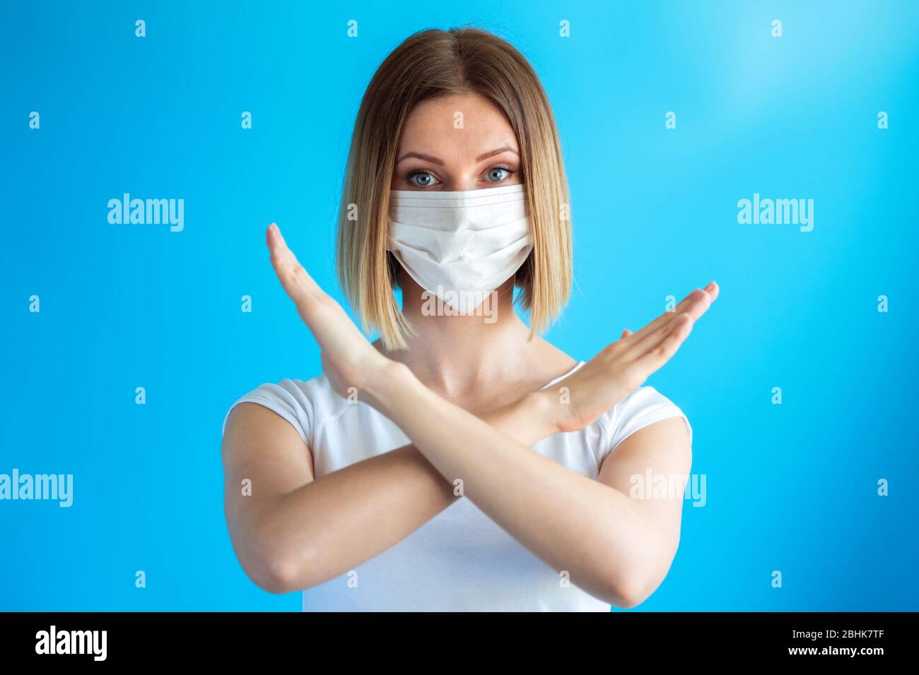 Attractive female nurse showing stop sign with his hand gesture ...