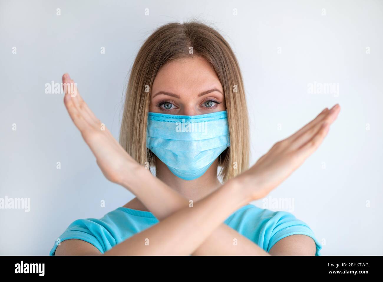 Attractive female nurse showing stop sign with his hand gesture ...