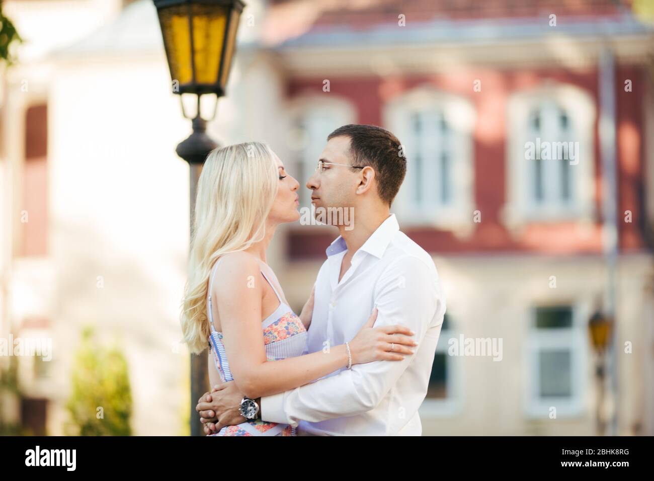Romantic tourist couple walking around the city relaxing Stock Photo ...