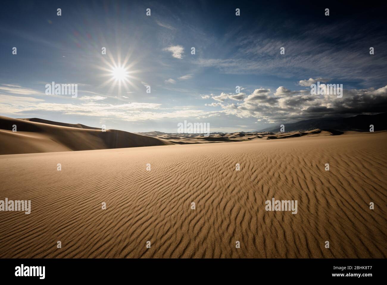 Dramatic sky at great sand dunes national park hi-res stock photography ...