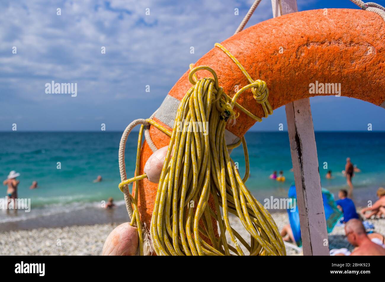 Orange emergency lifebuoy on a pebbly sea beach, close up Stock Photo ...