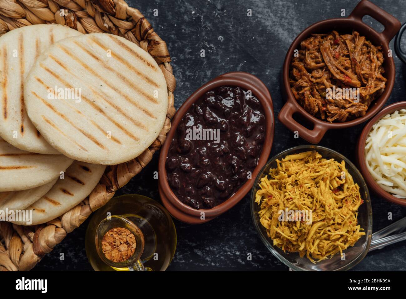 Top view of typical Latin American food. Group of arepas and different ...