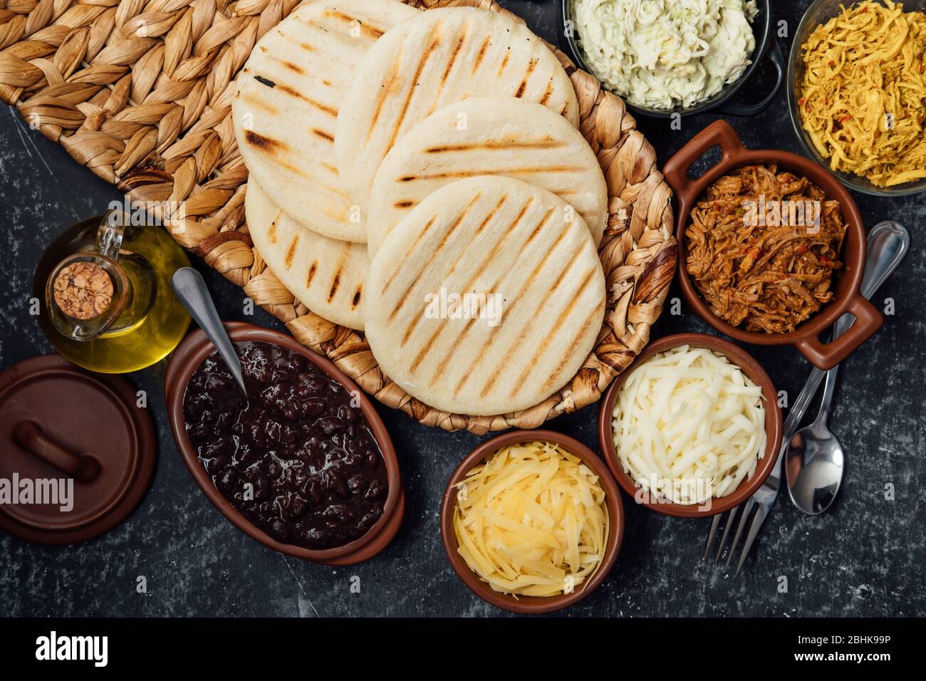 Top view of typical Latin American food. Group of arepas and different ...