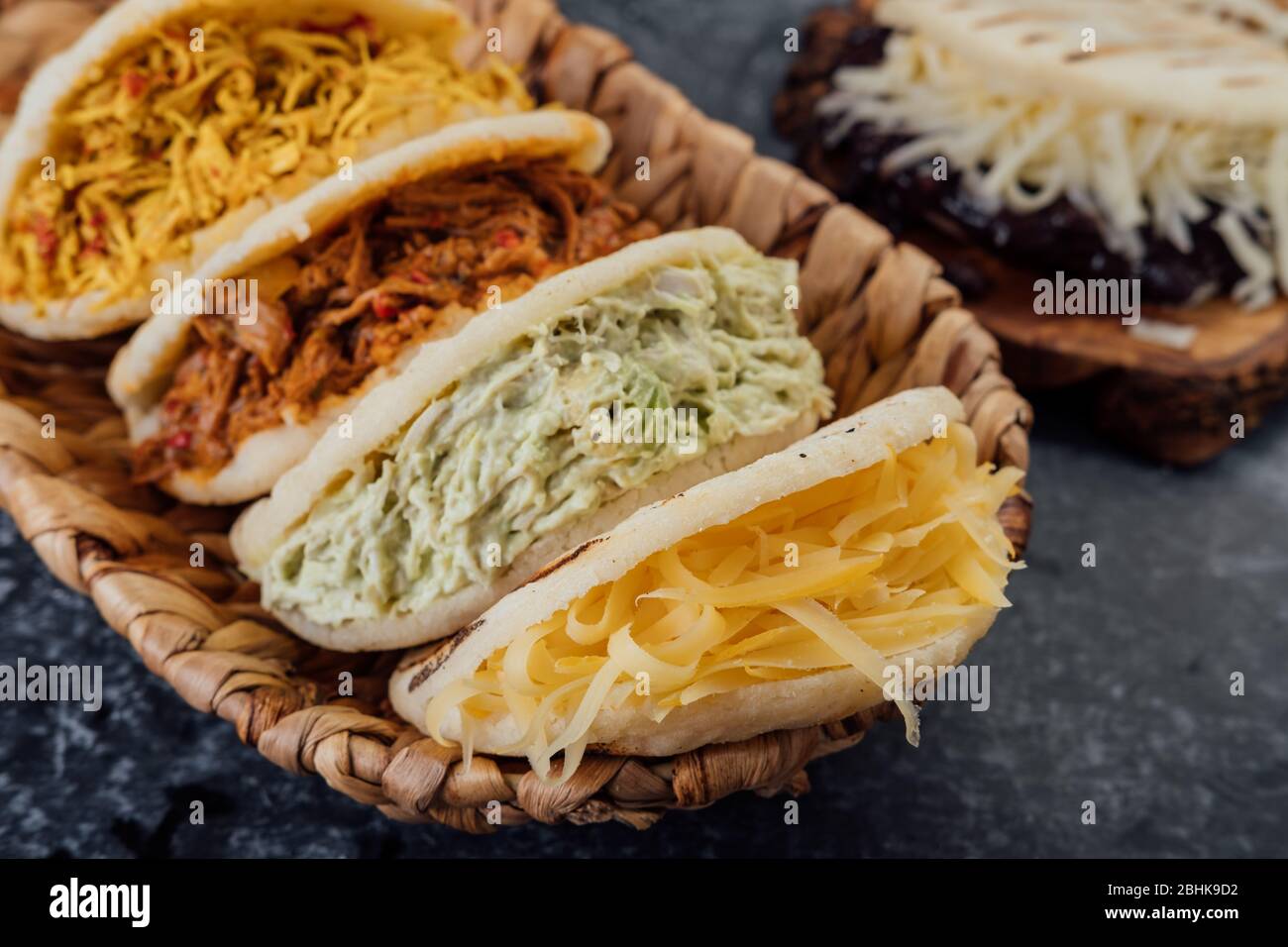Top view of various types of typical Venezuelan arepas in a woven ...