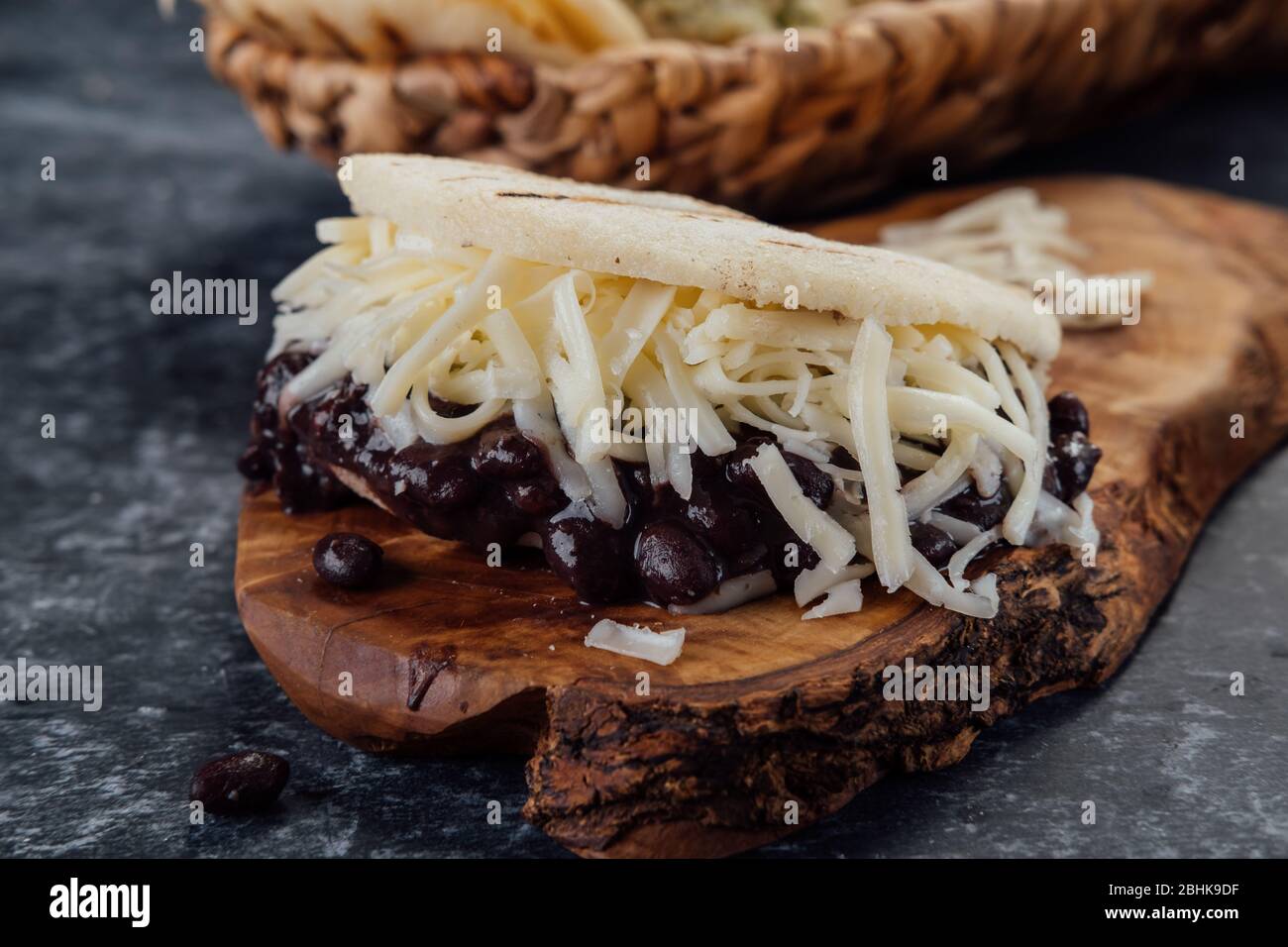 Arepa with black beans and white cheese. (Arepa domino Stock Photo - Alamy