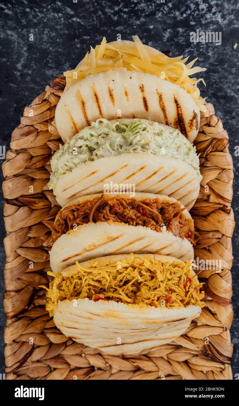 Top view of various types of typical Venezuelan arepas in a woven ...