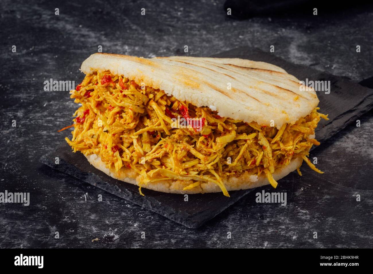 Arepa with chicken in strips. (Arepa pelua) Venezuelan typical food ...