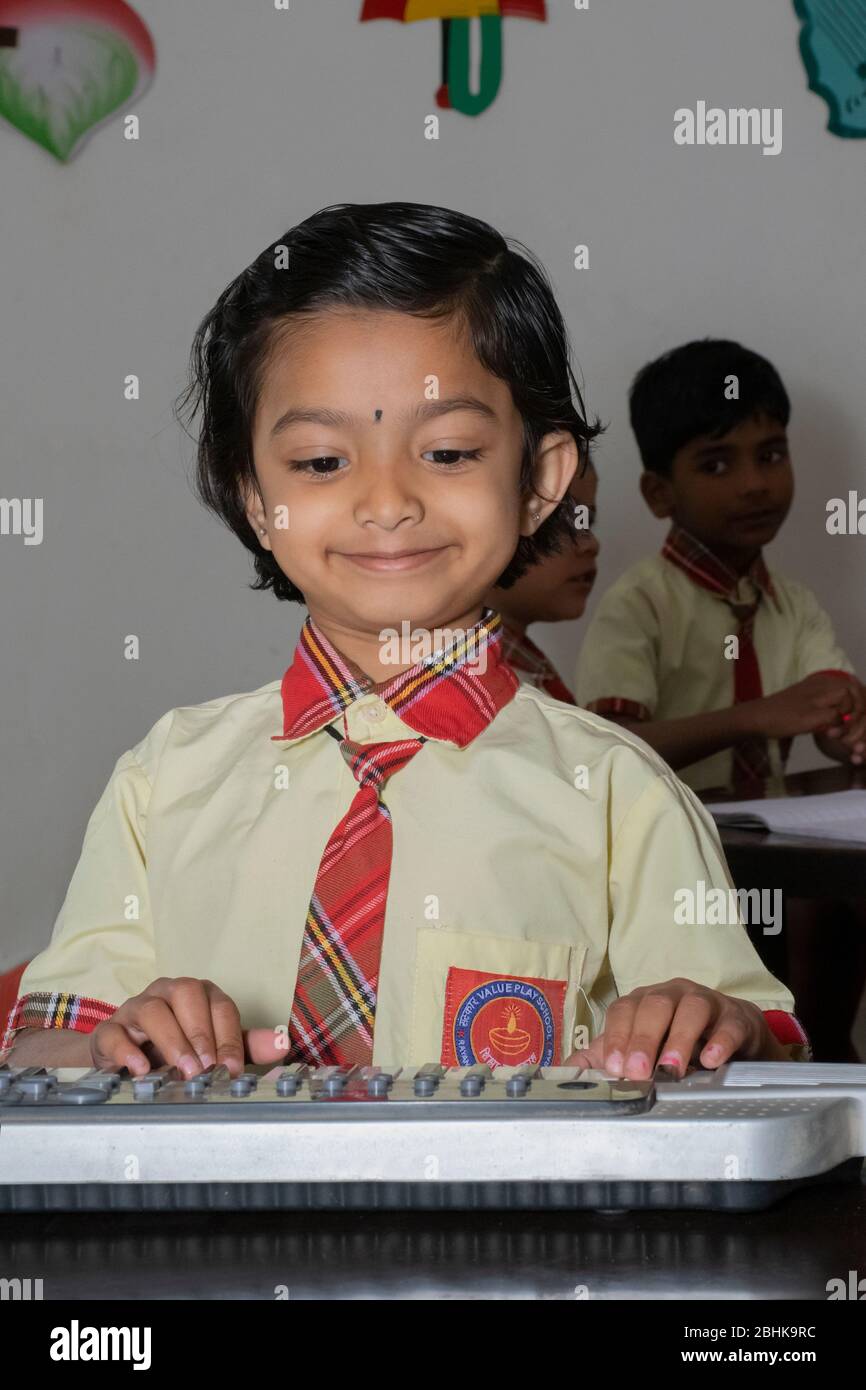 Elementary school playing music instrument at school classroom Stock ...