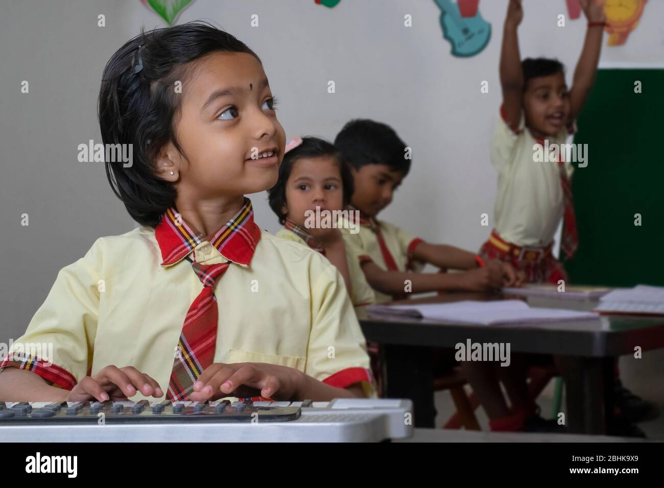 Elementary school playing music instrument at school classroom Stock ...