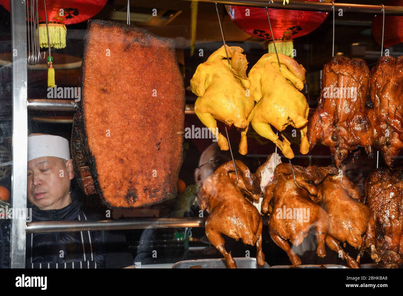 Roasted ducks hanging on rack showcase in restaurant's kitchen Stock ...