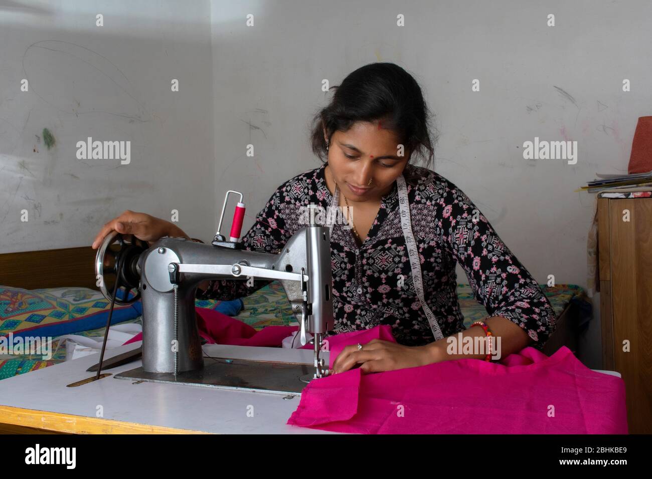 woman working on sewing machine as tailor Stock Photo - Alamy