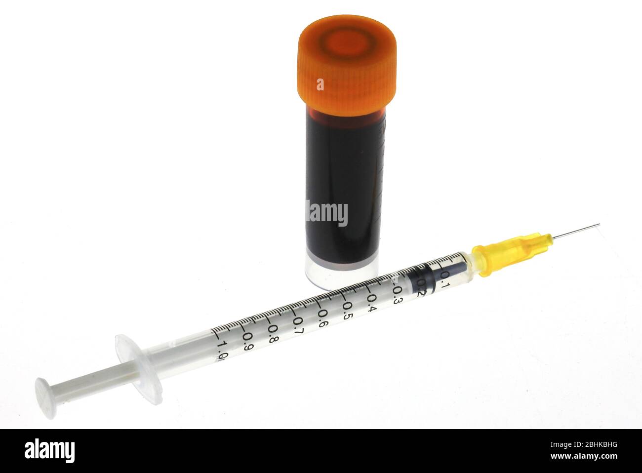 Syringe and blood sample vial Stock Photo - Alamy