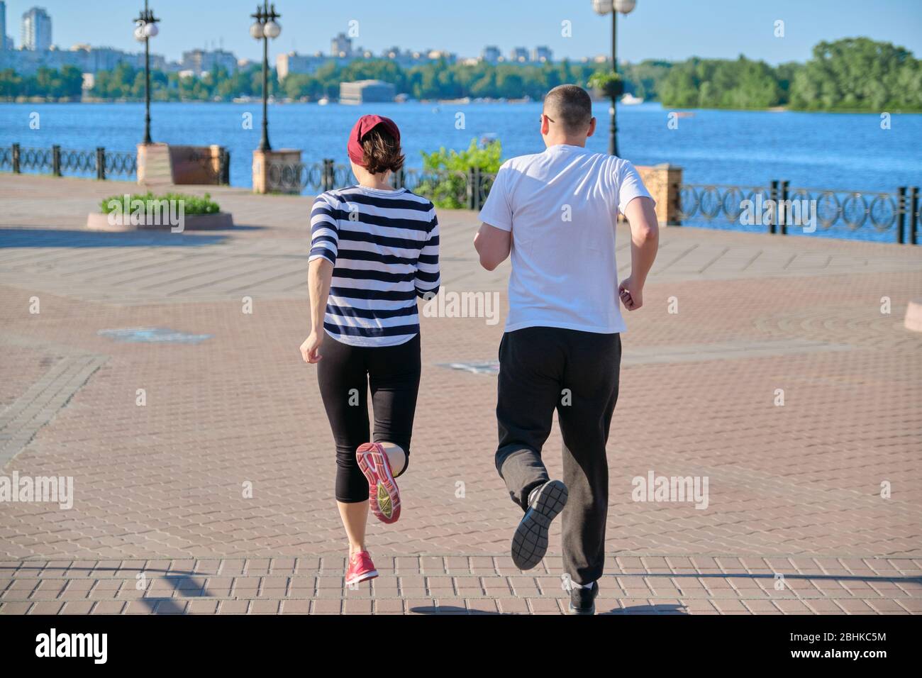 Couple of middle-aged man and woman running in park. Sport, fitness ...