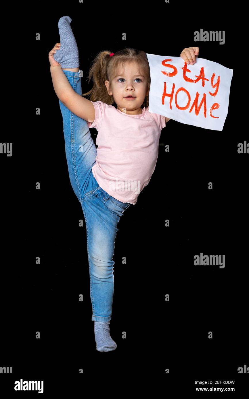 Little girl gymnast in quarantine raised her leg in twine.the call to ...