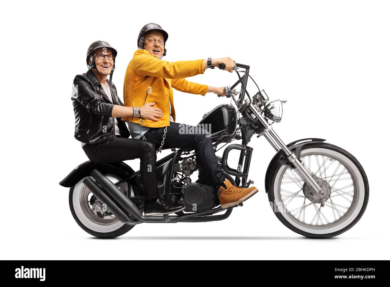 Elderly male friends on a chopper motorbike isolated on white ...