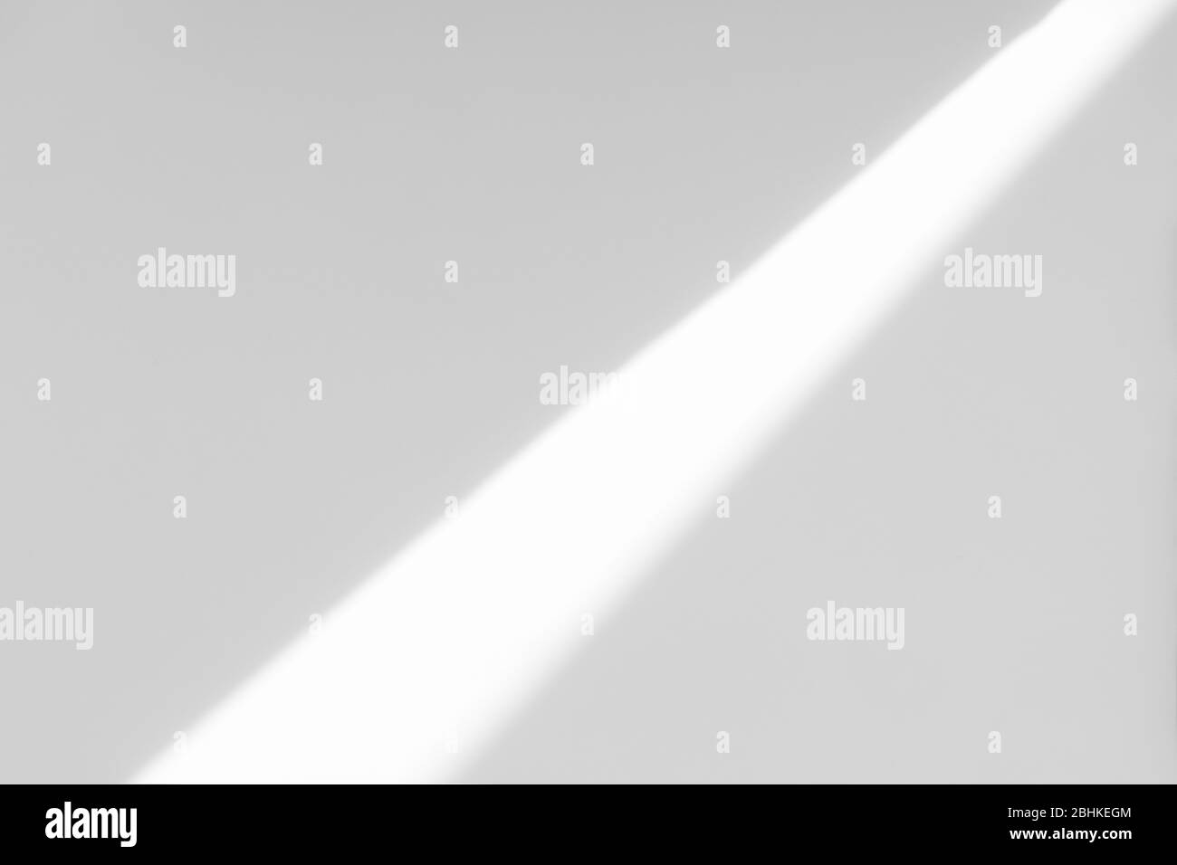 Organic drop shadow on a white wall Stock Photo - Alamy