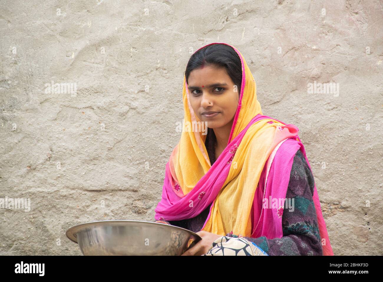 indian Rural villager woman sitting Charpai and Cutting Vegetable Stock ...