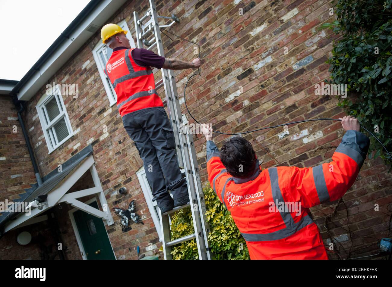 Virgin Media Engineers installing Stock Photo - Alamy