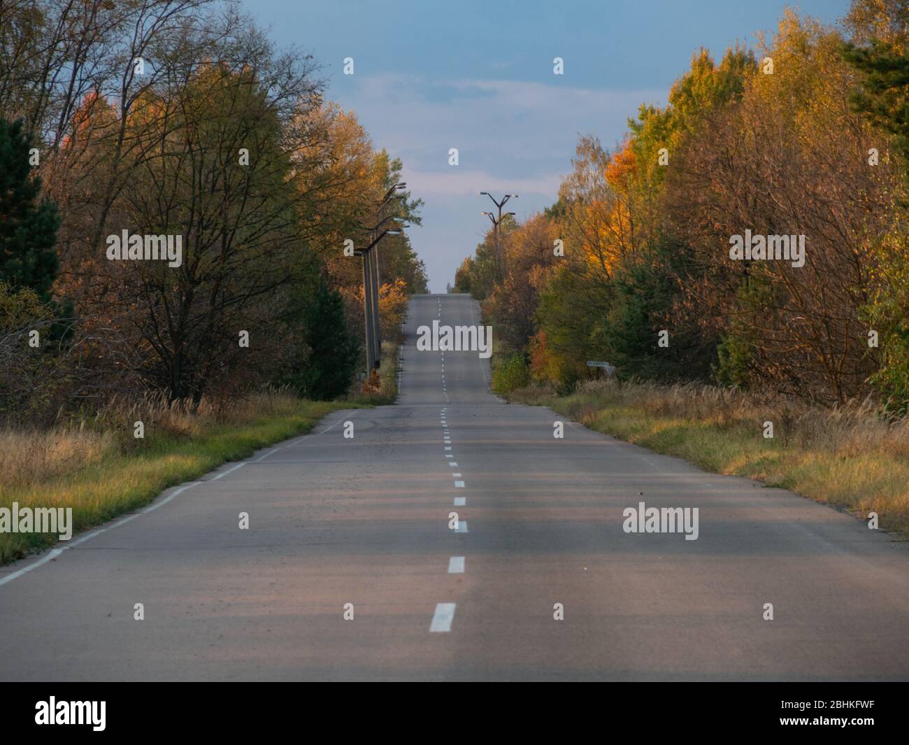 Chernobyl road in exclusion zone. Radioactive zone in Pripyat city ...
