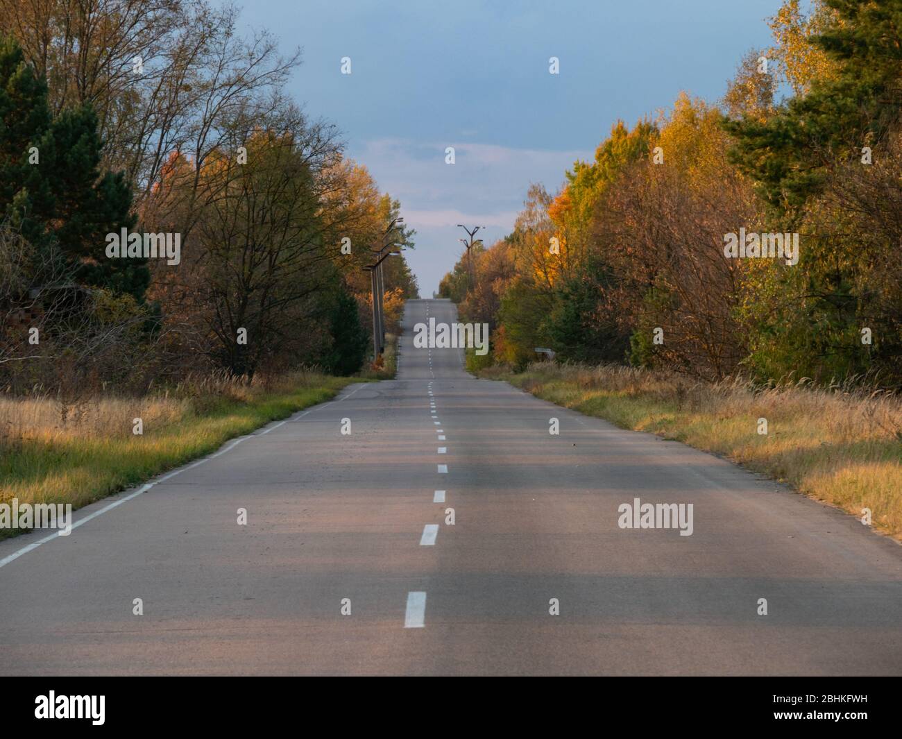 Chernobyl road in exclusion zone. Radioactive zone in Pripyat city ...