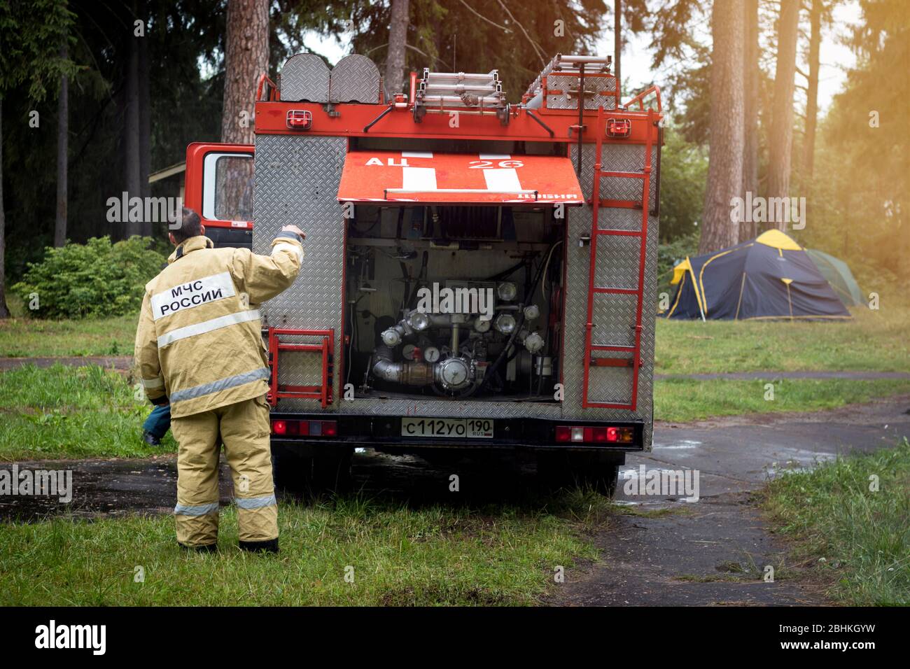 Dubna, Moscow Region, Russia - 20 June 2019 Fireman near a fire truck ...