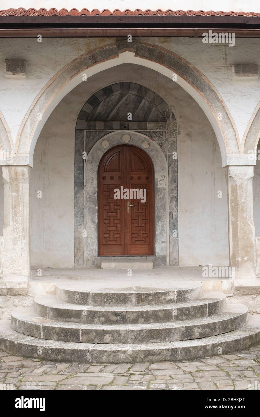 Entrance to an old Muslim building in oriental style, through an arch ...