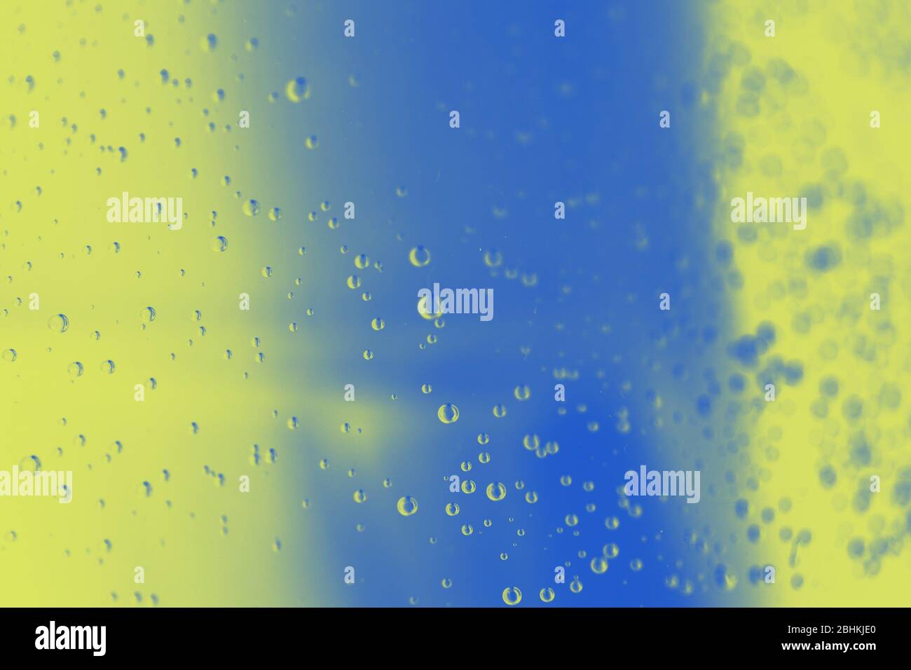 Blue yellow color blurred background with water drops Stock Photo - Alamy