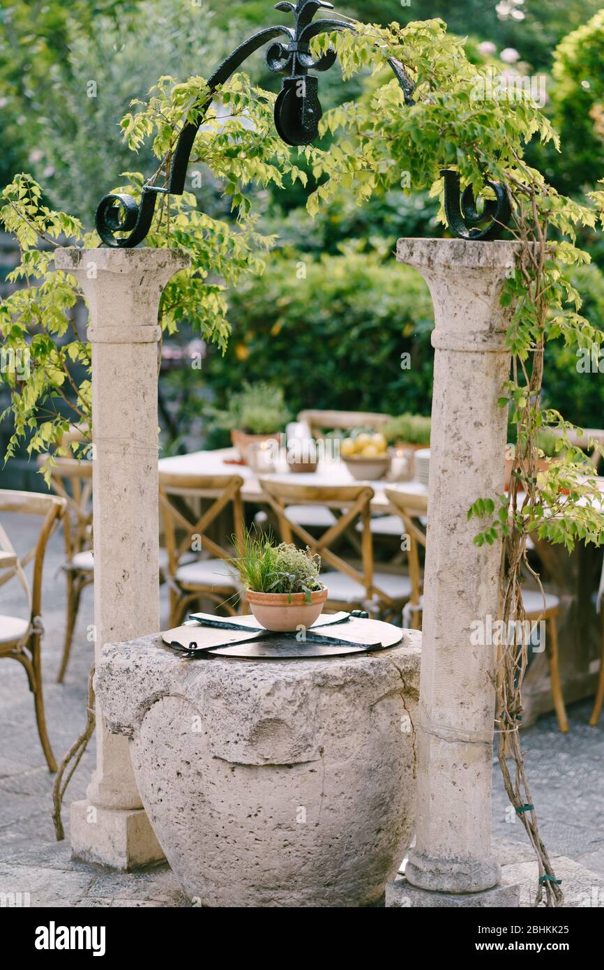 Ancient stone well on the island of Sveti Stefan in Montenegro Stock ...