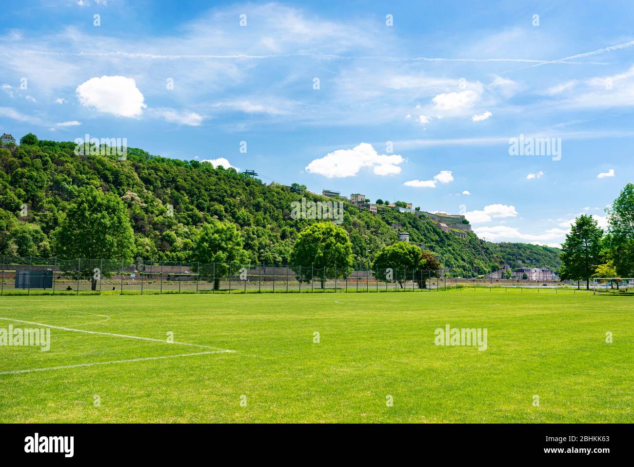 A football field located between the hills on a beautiful spring day ...
