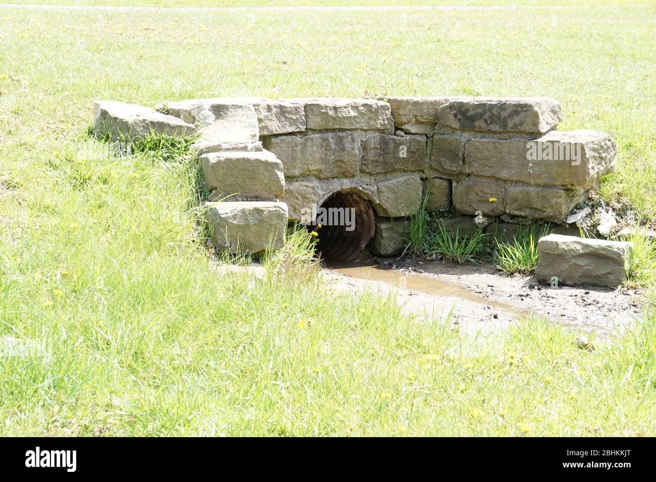 Stone wall drain in grass hi-res stock photography and images - Alamy