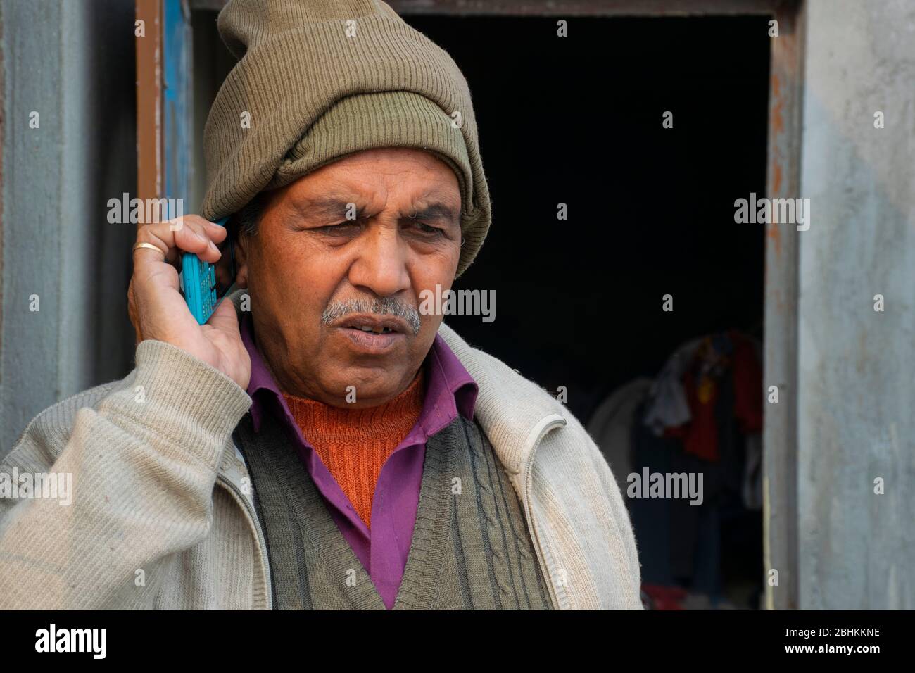 Indian old man talking phone hi-res stock photography and images - Alamy