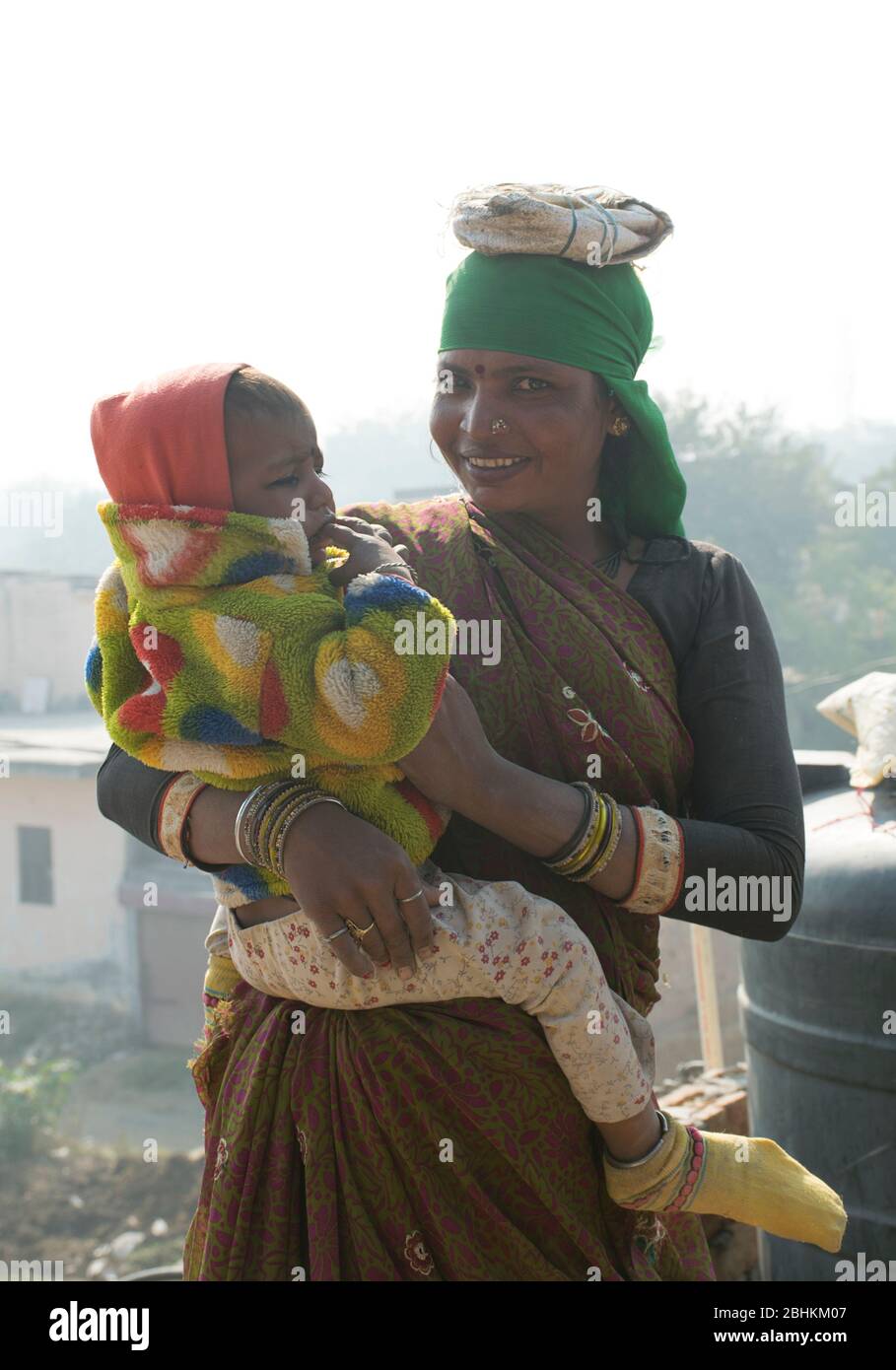 Indian rural mother and child, labourer woman holding her child Stock ...
