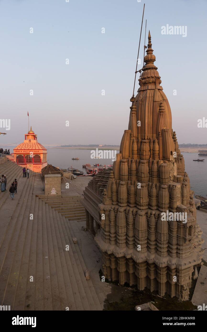 Old stone carved temple on the bank of river Ganges in Varanasi, India ...