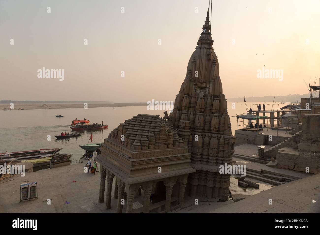 Old stone carved temple on the bank of river Ganges in Varanasi, India ...