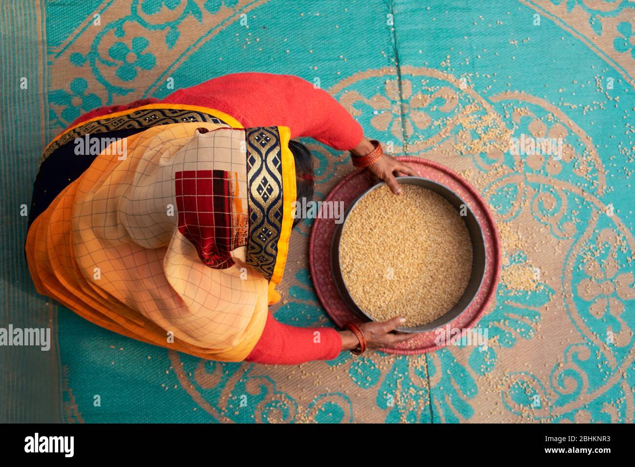 Indian women cleaning food grains Stock Photo - Alamy