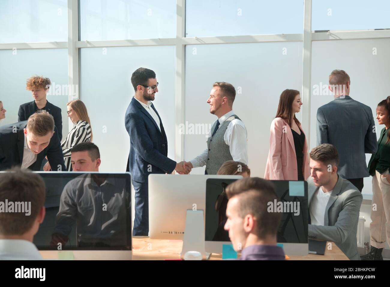 business people greet each other in the office Stock Photo - Alamy
